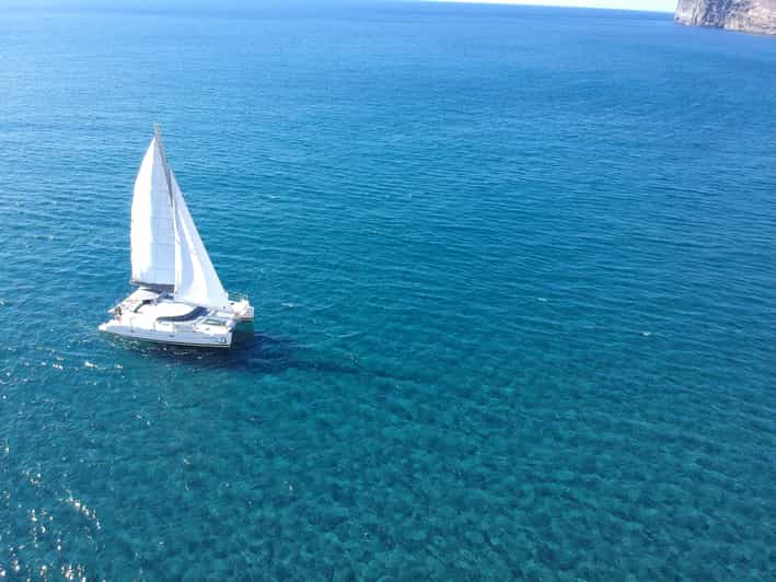 Santorini: Full Day Catamaran Excursion with Food & Drinks | GetYourGuide