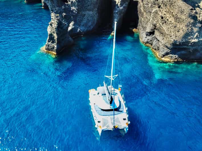 Santorini: Full Day Catamaran Excursion with Food & Drinks | GetYourGuide