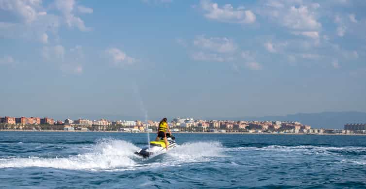 Valencia: Excursión en moto de agua con paddle surf | GetYourGuide