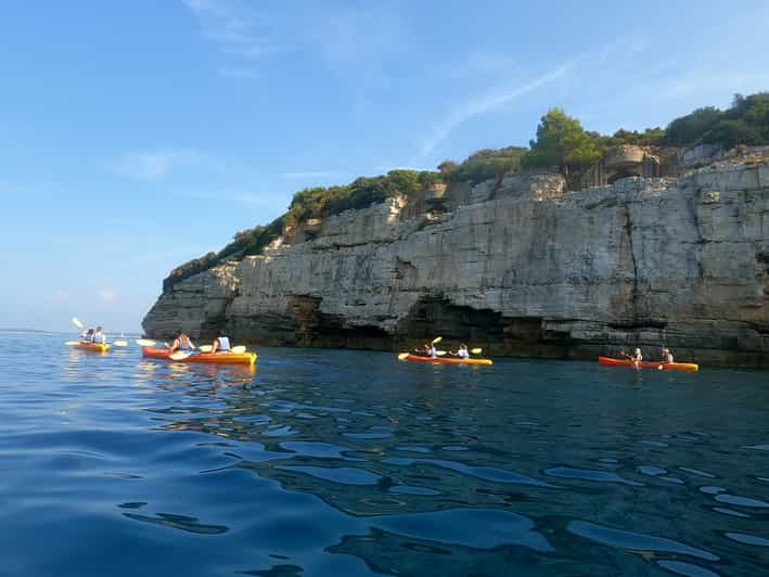 Pula: Sea Cave and Cliffs Guided Kayak Tour in Pula | GetYourGuide