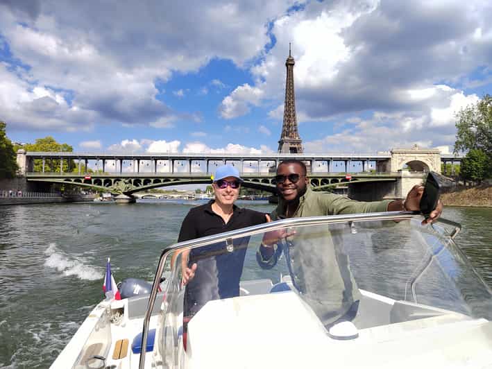 Paris: Heart of Paris Private Boat Tour with Bottle of Wine | GetYourGuide