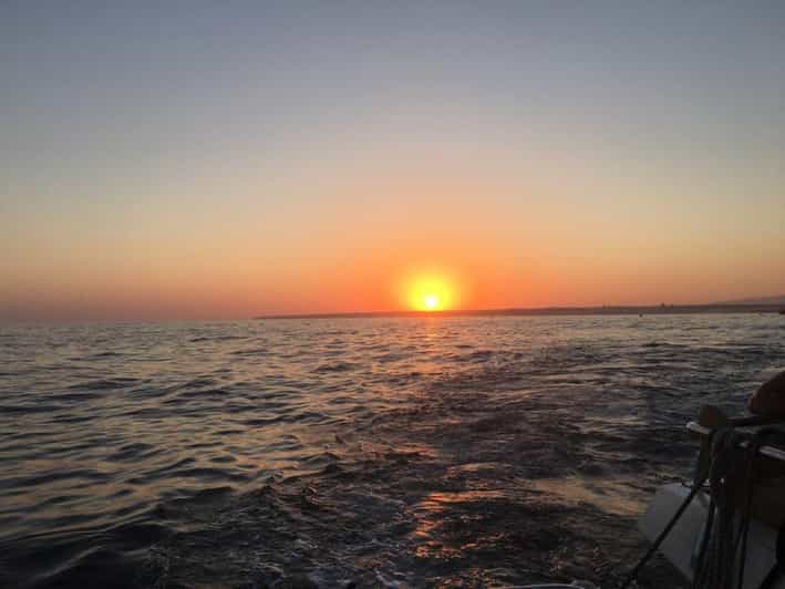 De la Albufeira: Sunset Kayak și SUP Tour la Peștera Benagil | GetYourGuide