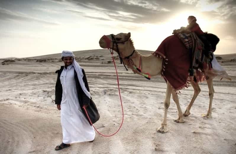 Doha Desert Safari: Sandboarding, Camel Ride & Swimming Fun | GetYourGuide