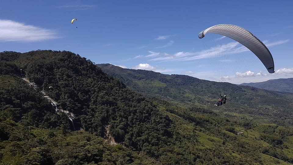 From Medellin: Private Paragliding Tour Over Waterfalls | GetYourGuide