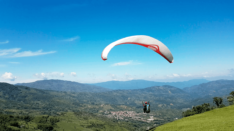 From Medellin: Private Paragliding Tour Over Waterfalls | GetYourGuide