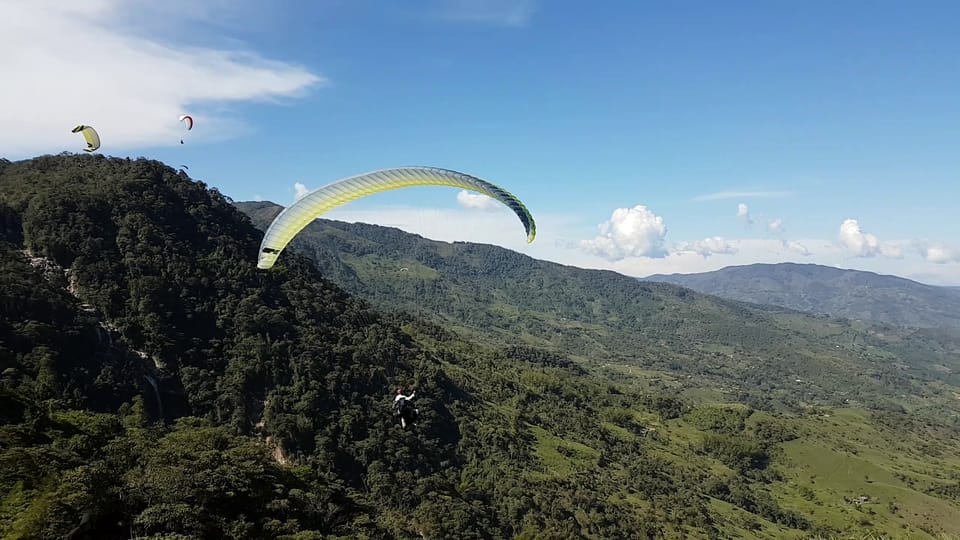 From Medellin: Private Paragliding Tour Over Waterfalls | GetYourGuide