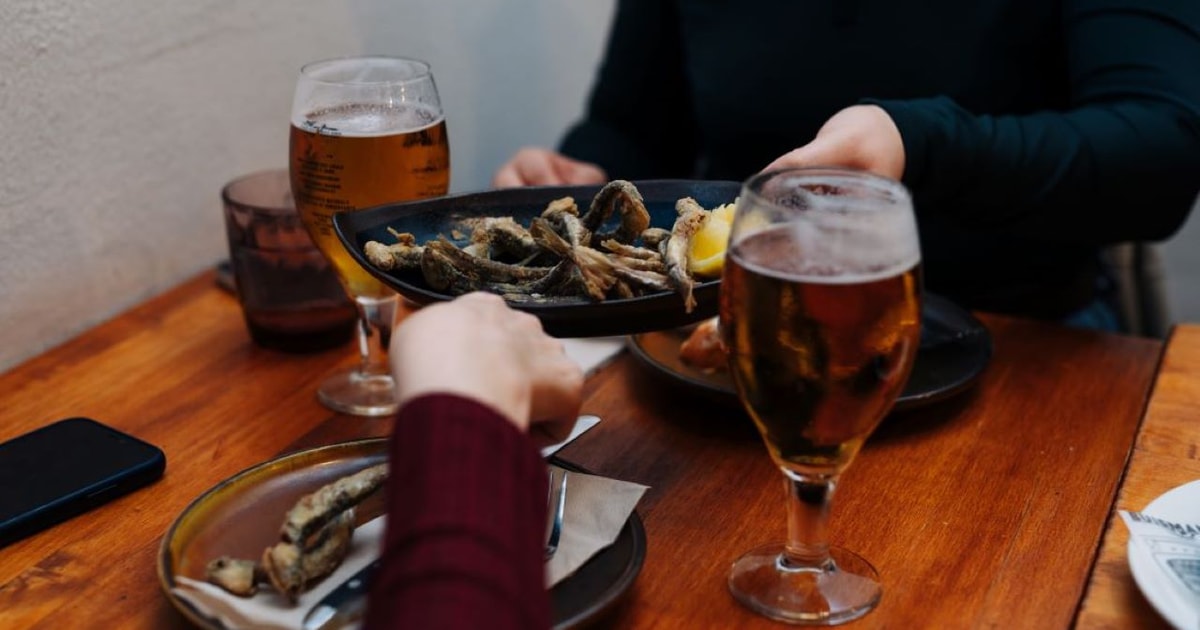 Lisbon: Tipsy Food Walking Tour with Snacks and Drinks | GetYourGuide