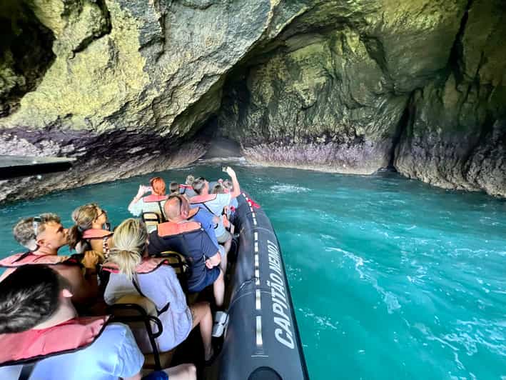 Portimão: Dolphin Spotting & Benagil Caves Guided Boat Tour | GetYourGuide
