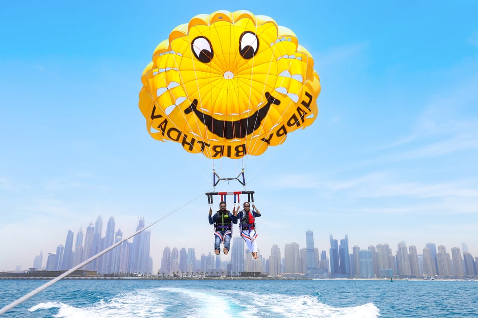 Dubai: Parasailing with Happy birthday Parachute JBR & Palm | GetYourGuide