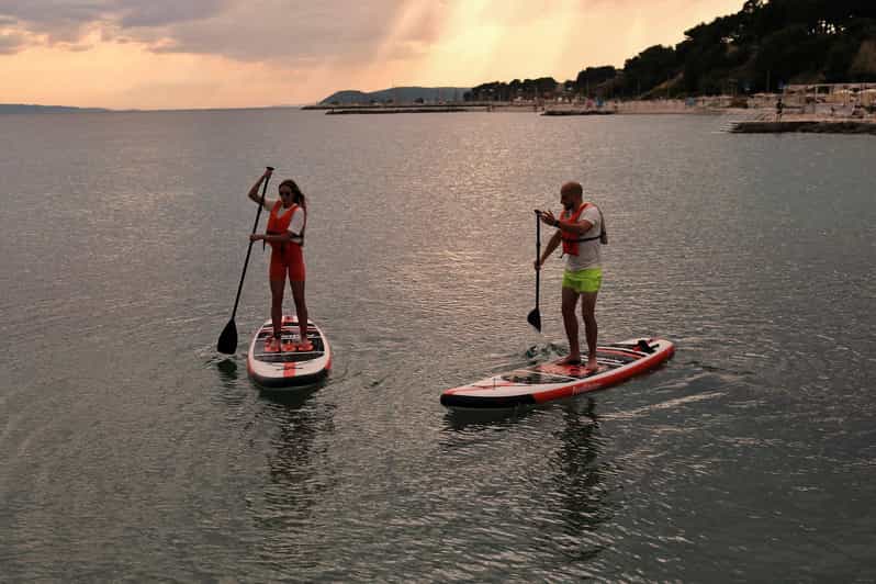 Witness the Magic: Glowing Sunset SUP Adventure in Split | GetYourGuide