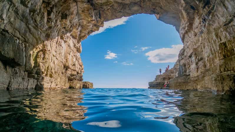 Seagull rocks: Boat tour with snorkeling in caves | GetYourGuide