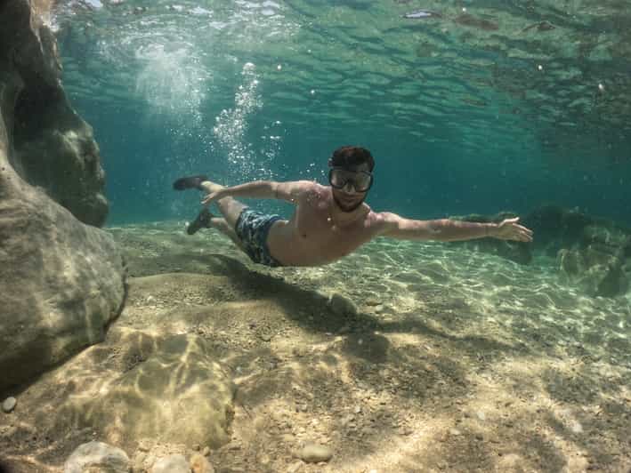 Seagull rocks: Boat tour with snorkeling in caves | GetYourGuide