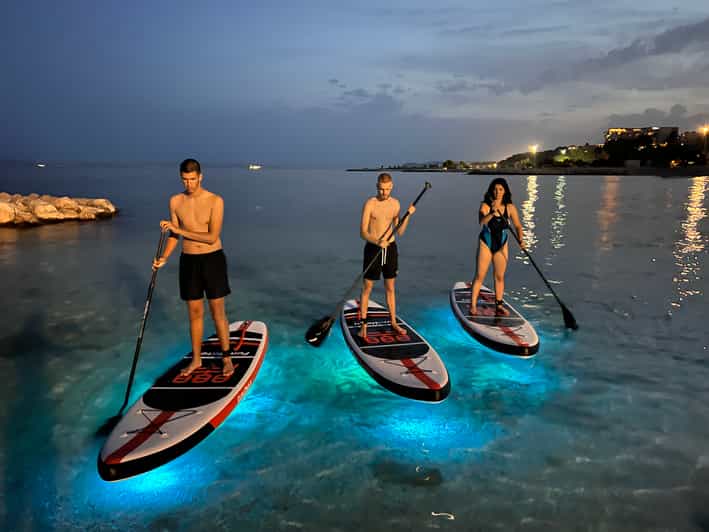 Split: Glow-in-the-dark Sunset Stand-Up Paddle Board Tour | GetYourGuide