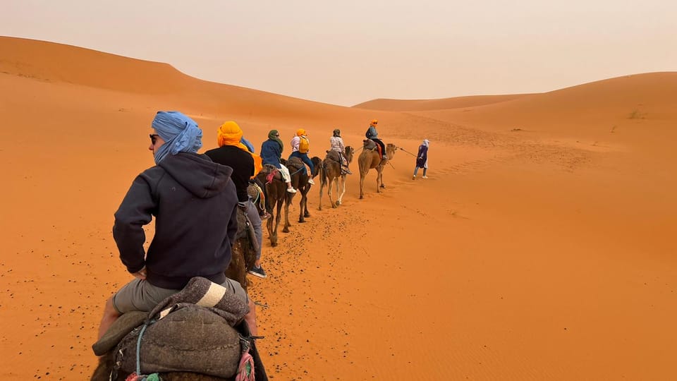 Merzouga: Overnight Camel Trek with Sandboarding | GetYourGuide