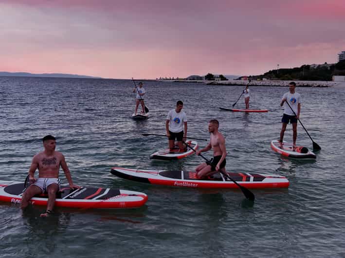 Split: Glow-in-the-dark Sunset Stand-Up Paddle Board Tour | GetYourGuide