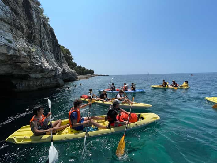 Pula: Island Kayak Tour, Snorkeling and Cliff Jumping | GetYourGuide