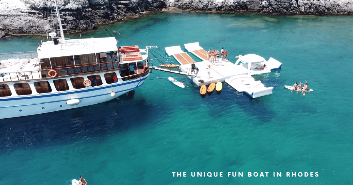 Rhodes: Boat Cruise with Food, Drinks, SUP, Kayak & Swimming | GetYourGuide