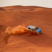 Dubai: Desert Safari, Dune Buggy, Sandboarding, Camels & BBQ | GetYourGuide