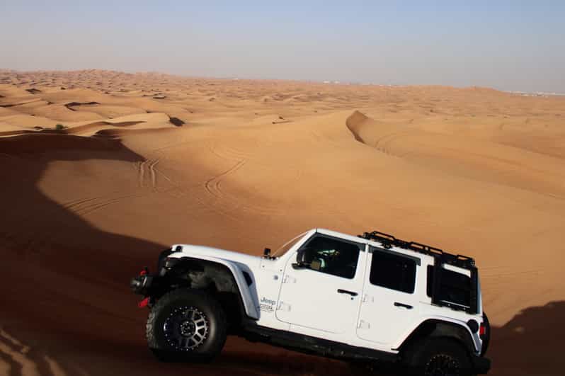Dubai Jeep Wrangler Sunset Desert Experience & Sandboarding | GetYourGuide