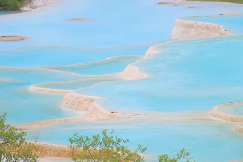 Huanglong Scenic Area: Explore Stunning Five-Colored Ponds | GetYourGuide