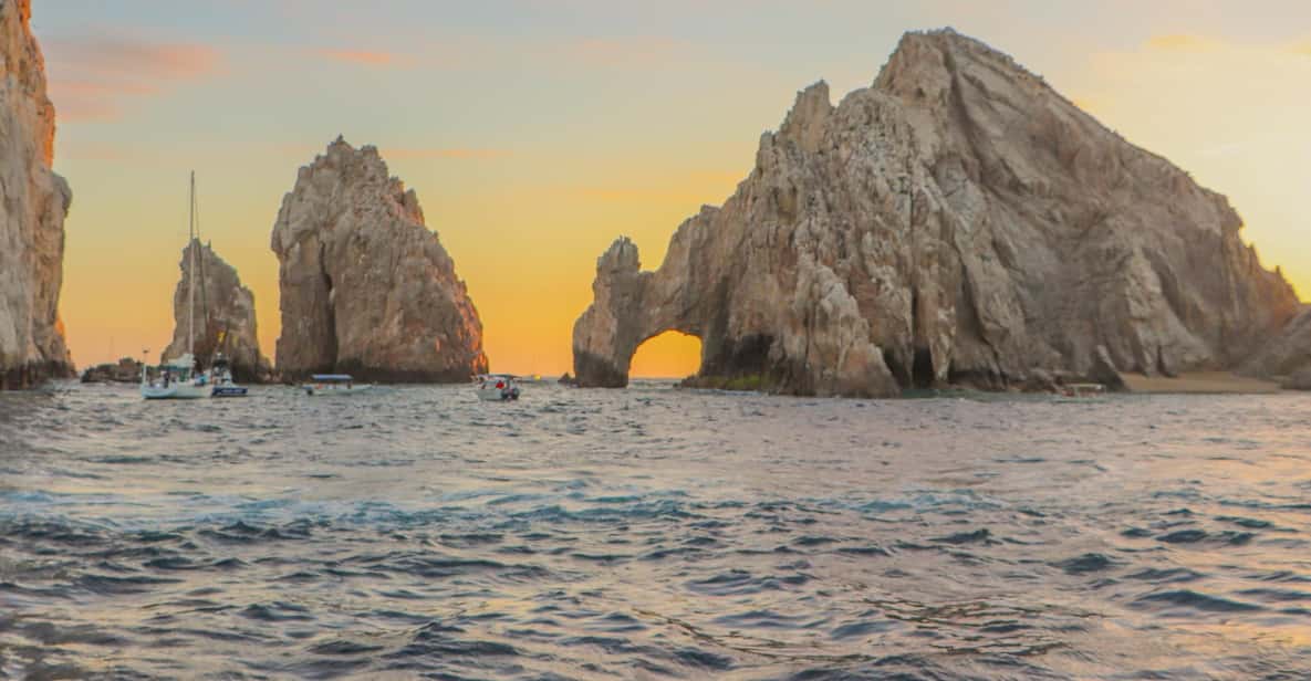 Sunset on a sailboat + Dinner with views of the Cabo Arch | GetYourGuide