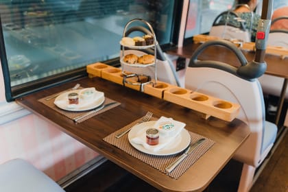 London: Afternoon Tea Bus with a Glass of Prosecco | GetYourGuide
