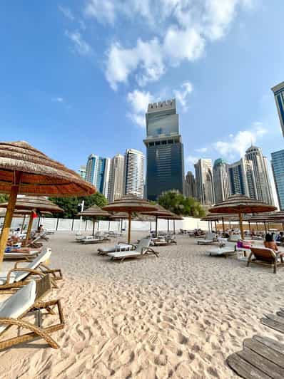 Doha: Doha Sands Beach Club Entry with Sunbed, Towel & Water | GetYourGuide