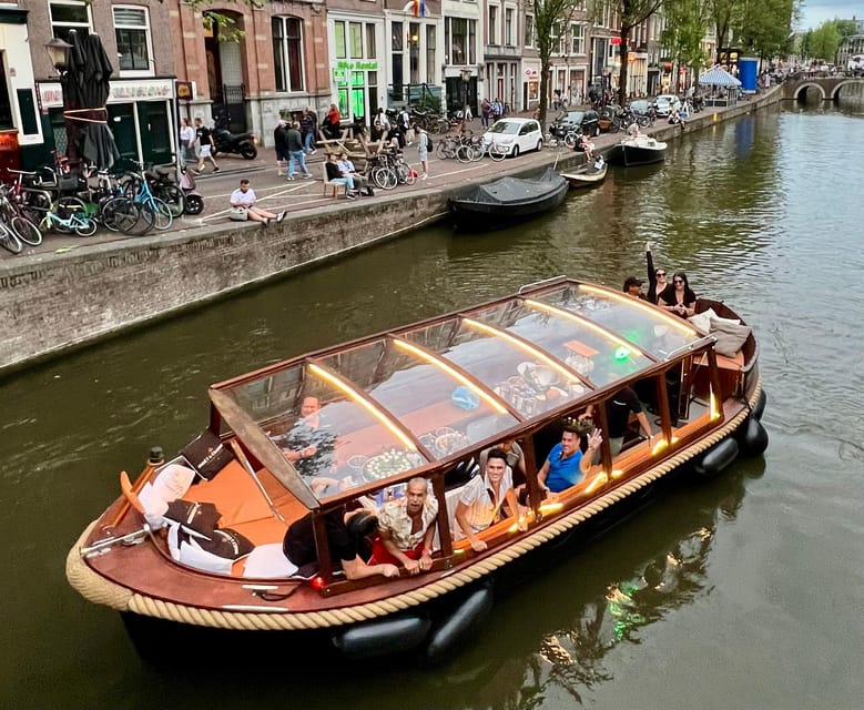 Amsterdam: Open Boat Tour with Optional Unlimited Drinks | GetYourGuide