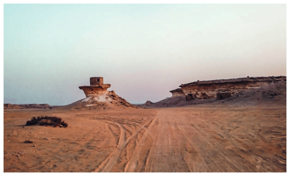 Doha:West tour to Richard Sierra sculpture, Umbrella Rock | GetYourGuide