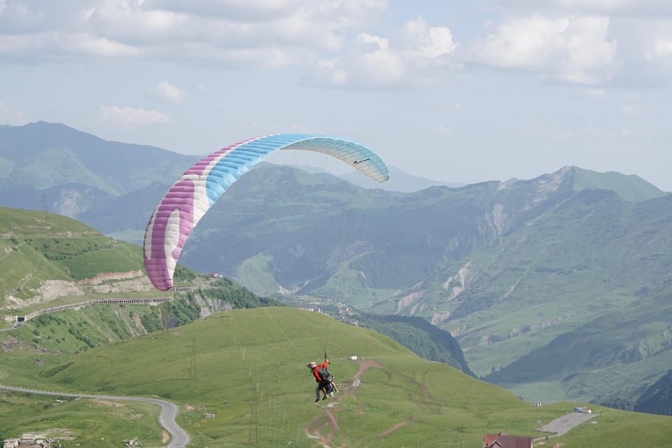 Georgia: Paragliding flight in the mountains and video of it | GetYourGuide