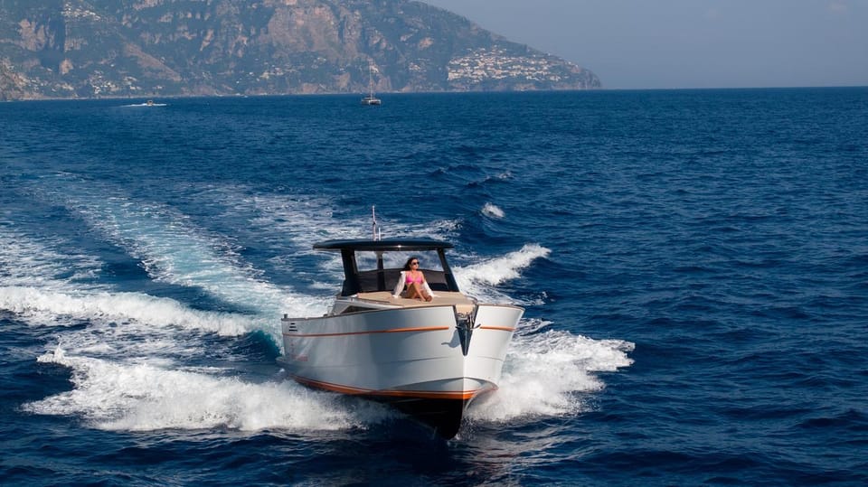 From Positano: Private Tour to Capri on a 2024 Gozzo Boat | GetYourGuide