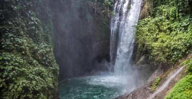 Jumping Sliding at Aling- Aling Waterfall and Handara Gate | GetYourGuide