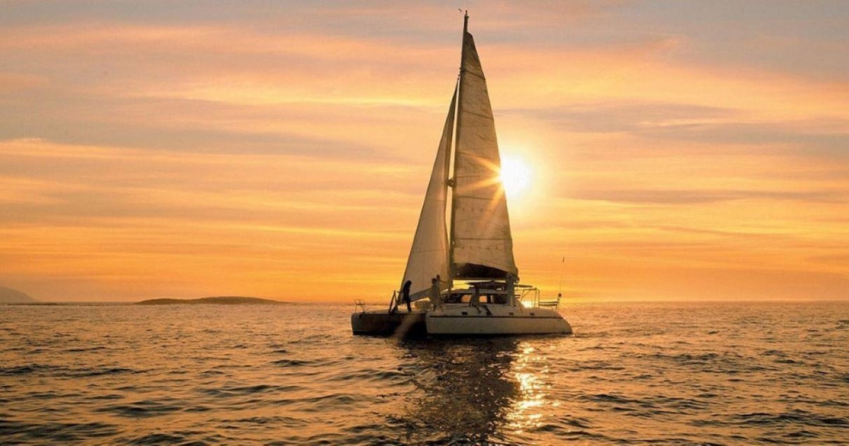 Exclusive Sundowner catamaran with dinner & Transportation | GetYourGuide
