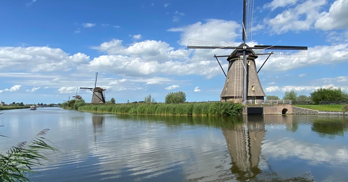 Amsterdam: Kinderdijk, Euromast, Delft en Den Haag Dagtour | GetYourGuide