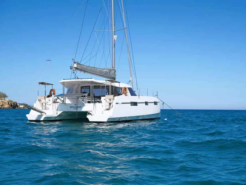 Milos: Kleftiko Bay Catamaran Cruise with Meal & Sunset View | GetYourGuide