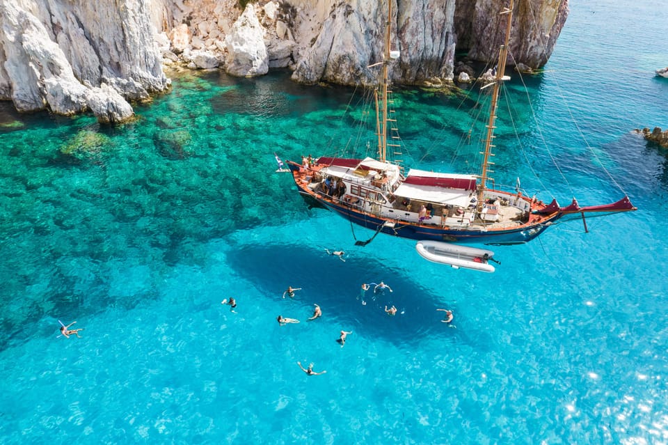 Milos: Full Day Cruise Via Traditional Boat | GetYourGuide