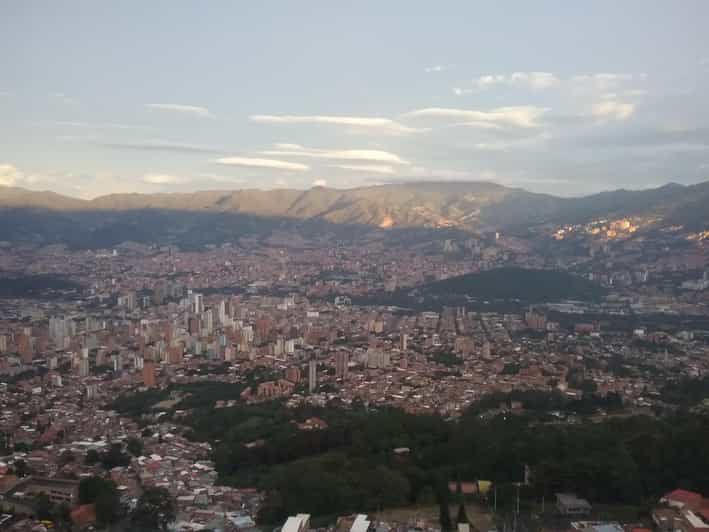 Fly over Medellín, Downtown metrocables lunch and Comuna 8 | GetYourGuide