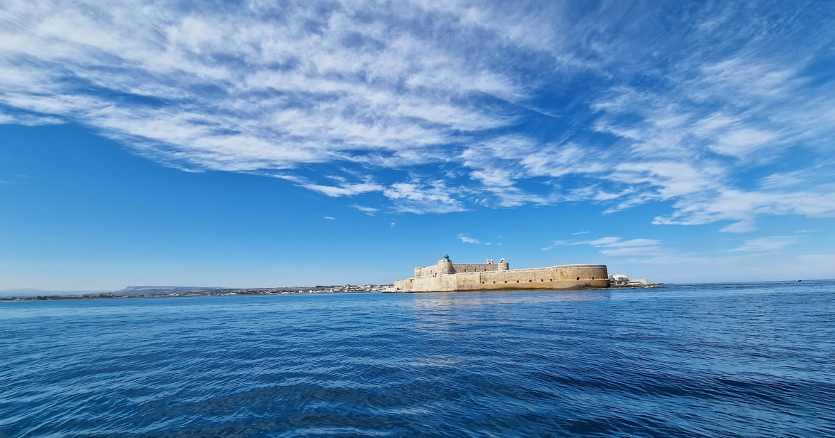 Siracusa:boat excursion of Ortigia and sea caves + swim stop | GetYourGuide