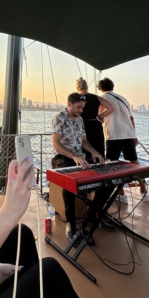 Live Music & Sunset Wooden Boat in Barcelona | GetYourGuide