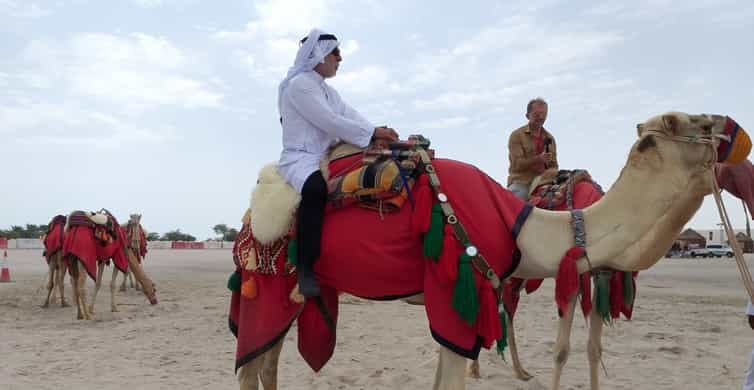 Doha: Desert Safari Dune Bashing, Sandboarding, & Camel Ride | GetYourGuide