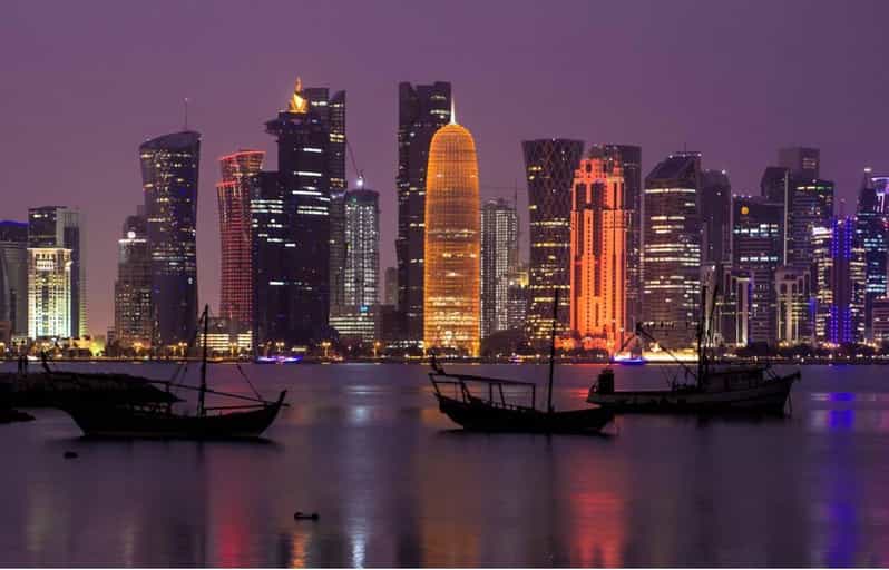 Doha: traditional Dhow Harbour, Skyline view , Sunset | GetYourGuide