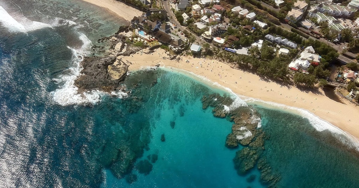 Fly over Reunion Island in a microlight | GetYourGuide