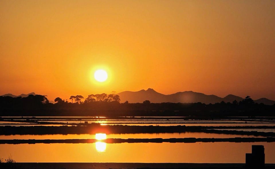 The salt pans of Marsala - Visit and sunset in the salt pan | GetYourGuide