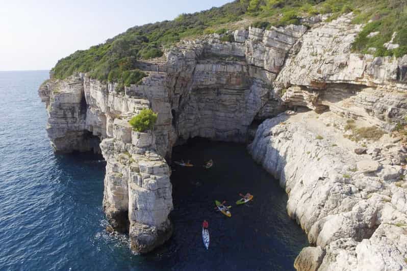 Pula: Half-Day Kayak, Cliff, and Cave Tour | GetYourGuide