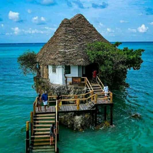 Stone Town, Kuza Cave Tour, Paje Beach, The Rock Restaurant | GetYourGuide