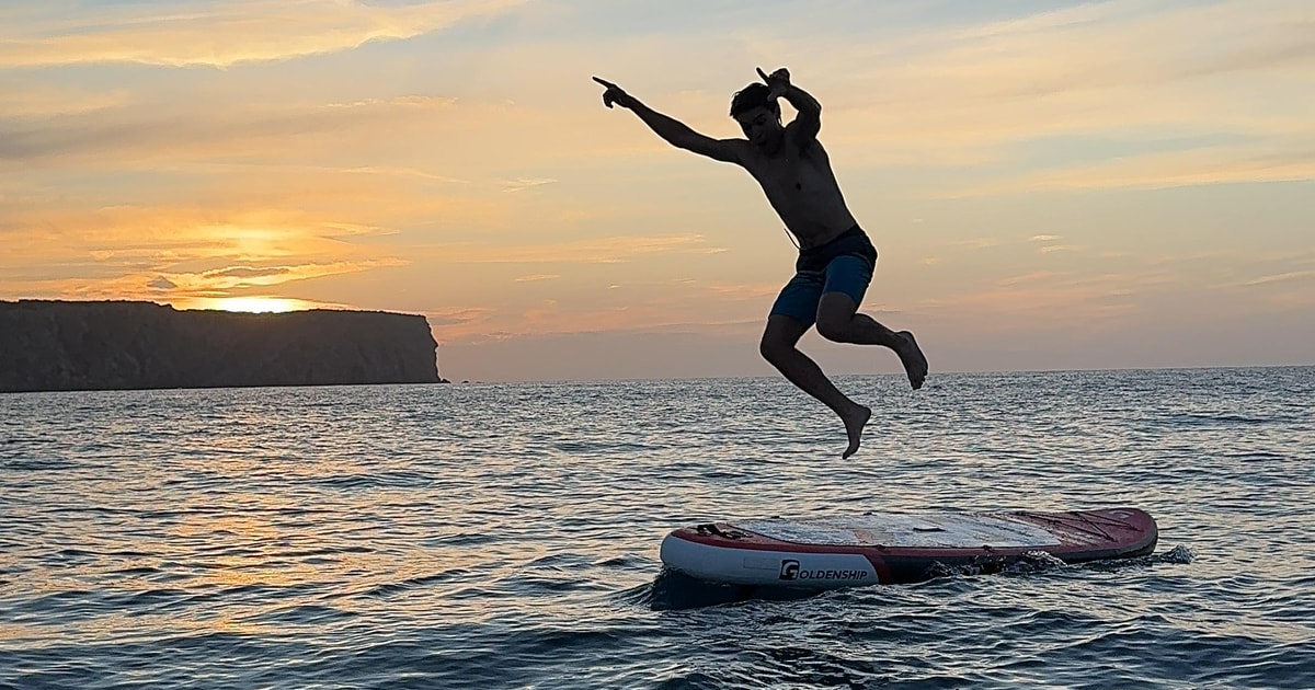 paddle surf sunset with LED light show | GetYourGuide