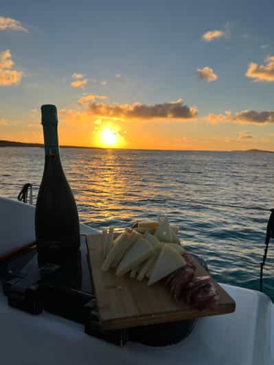 aperitifs at sunset on the Asinara Stintino catamaran | GetYourGuide