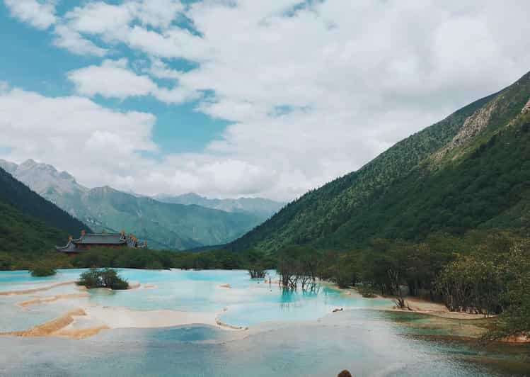 Huanglong Scenic Area: Explore Stunning Five-Colored Ponds | GetYourGuide