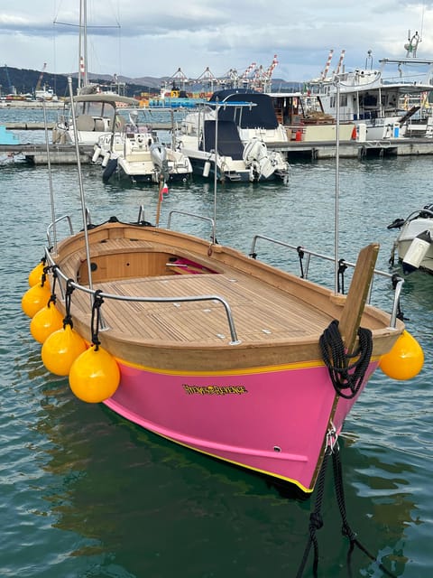 Amazing sunset on the pink Hyena in Portovenere | GetYourGuide