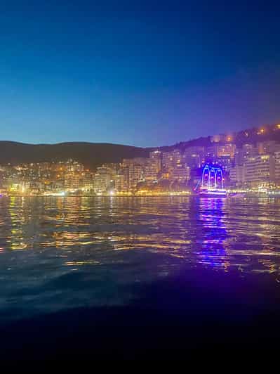 Saranda Sunset and Night City Glow Kayak/Sup tour | GetYourGuide
